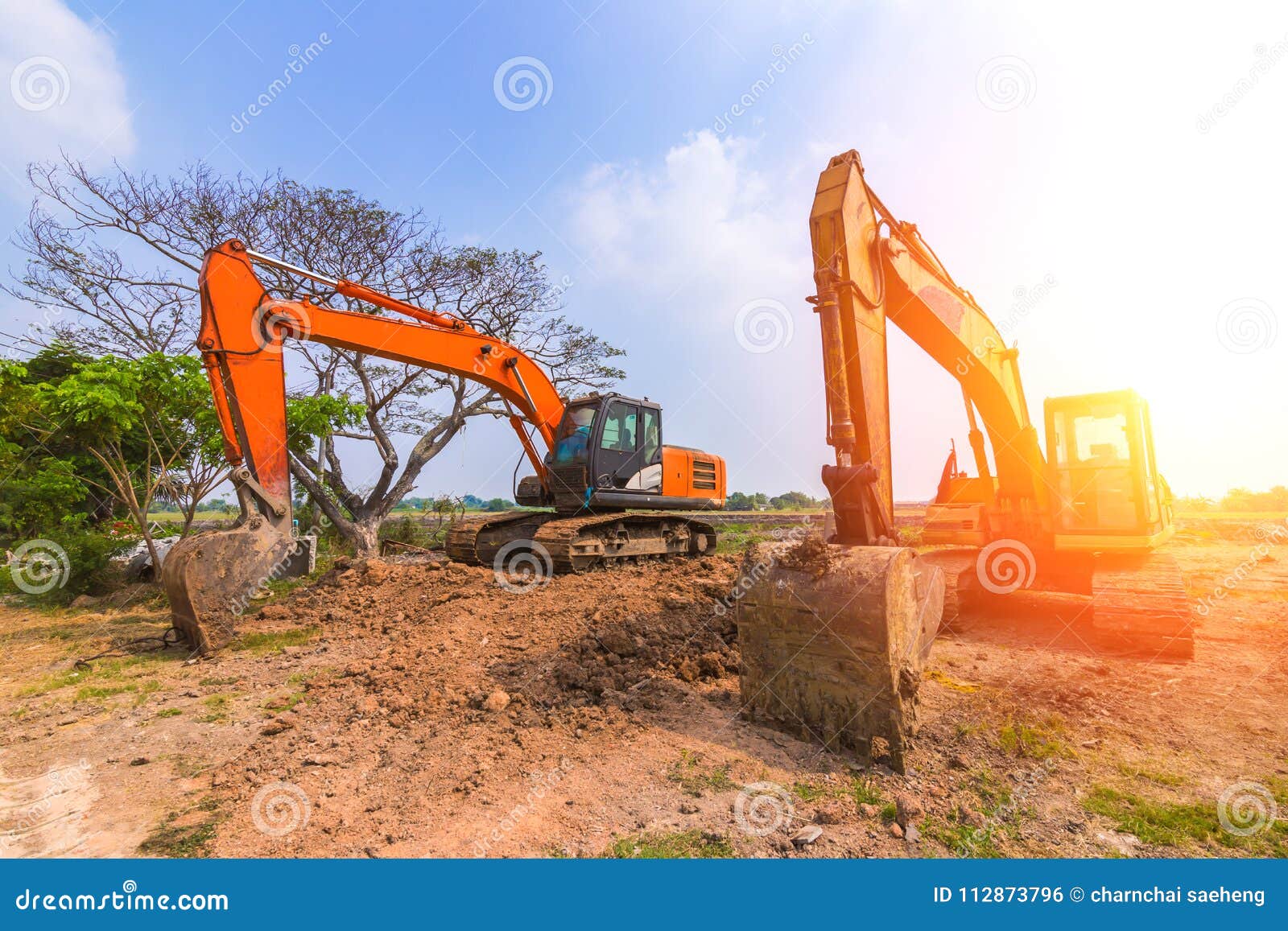 The Orange Backhoe is on the Ground. Stock Photo - Image of activity ...