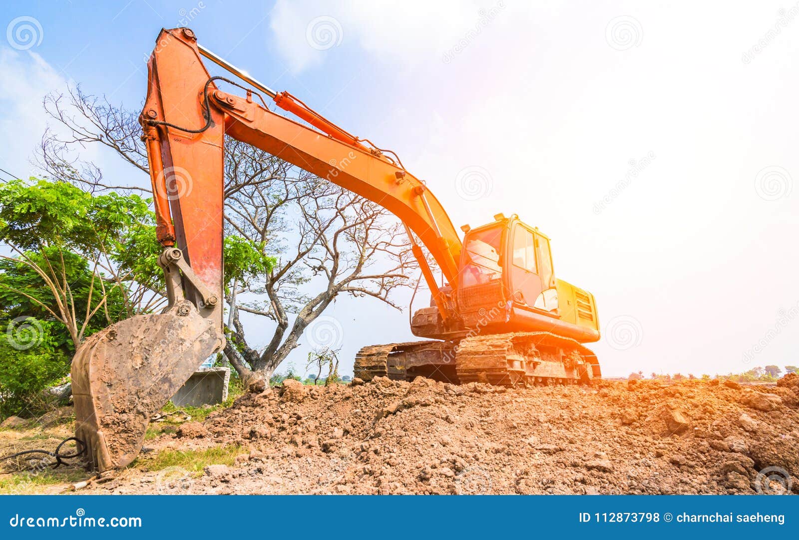 The Orange Backhoe is on the Ground. Stock Photo - Image of bulldozer ...