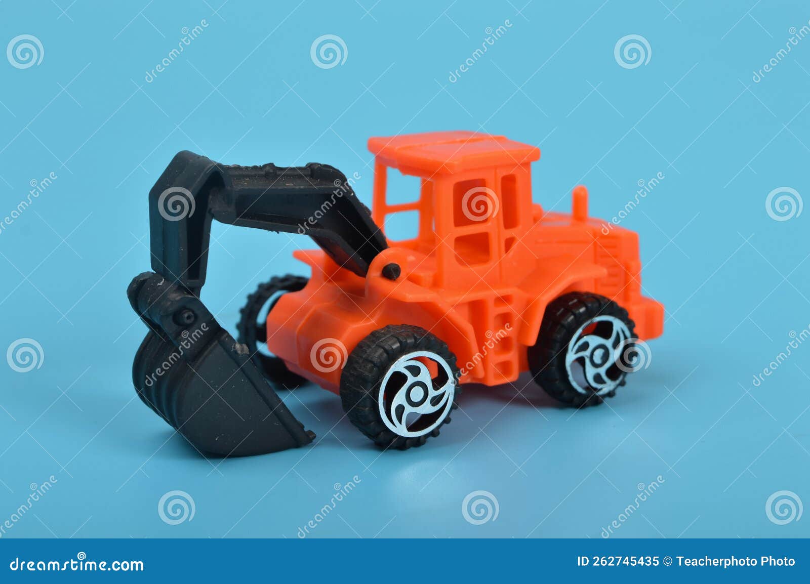An Orange Backhoe Loader Isolated on a Blue Background Stock Image ...