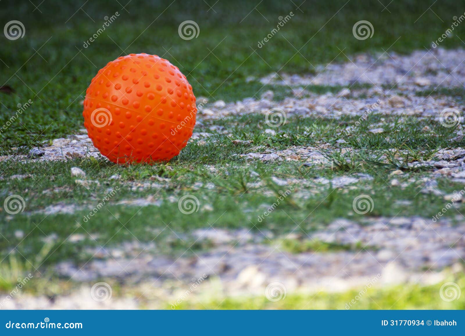 Orange ball on ground stock photo. Image of outdoors - 31770934