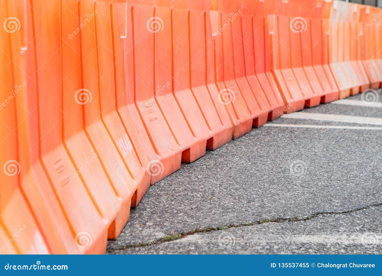 Orange barrier on the road stock image. Image of perspective - 135537455