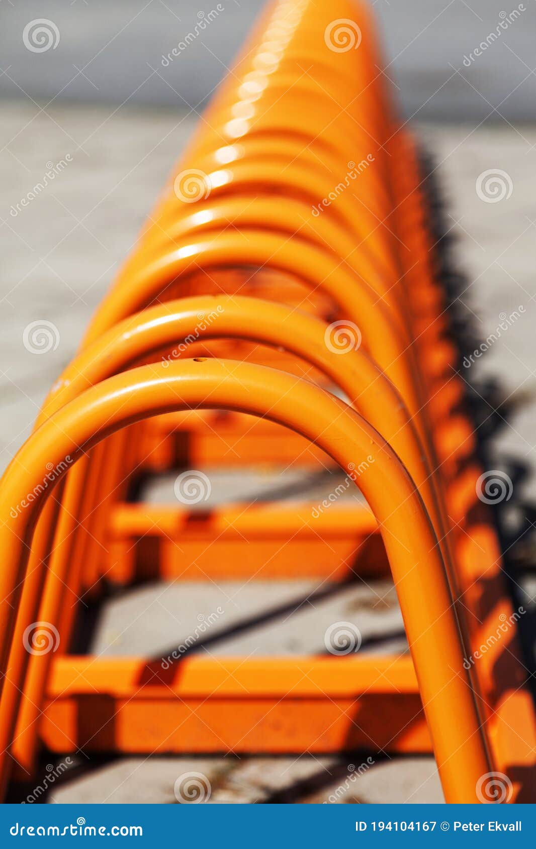 Orange Bicycle Racks in a Row by the River Stock Image - Image of ...