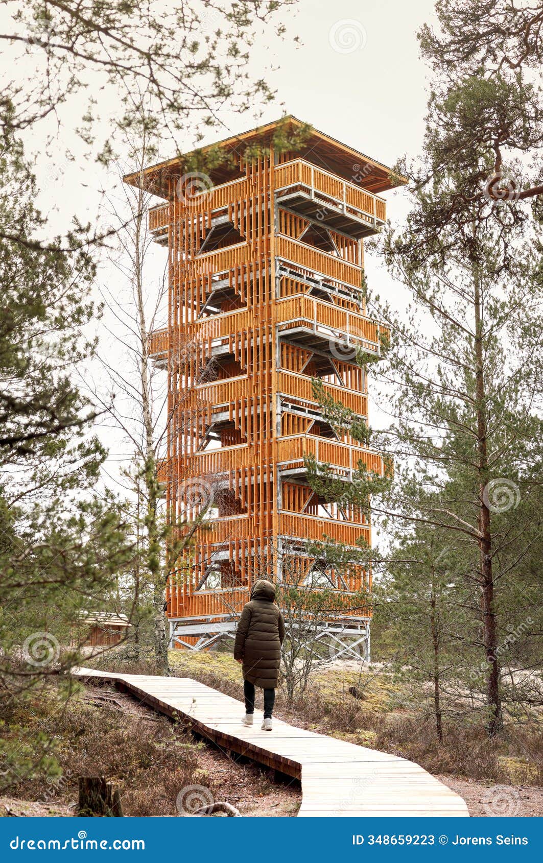 .an Orange Birdwatching Tower in the Forest with a Person Walking ...