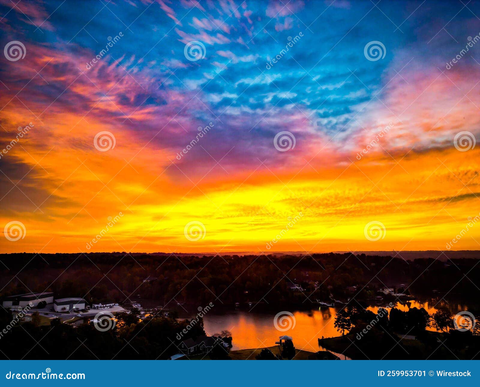 Orange-blue Sunset Sky Above the Village Silhouette with the River with ...