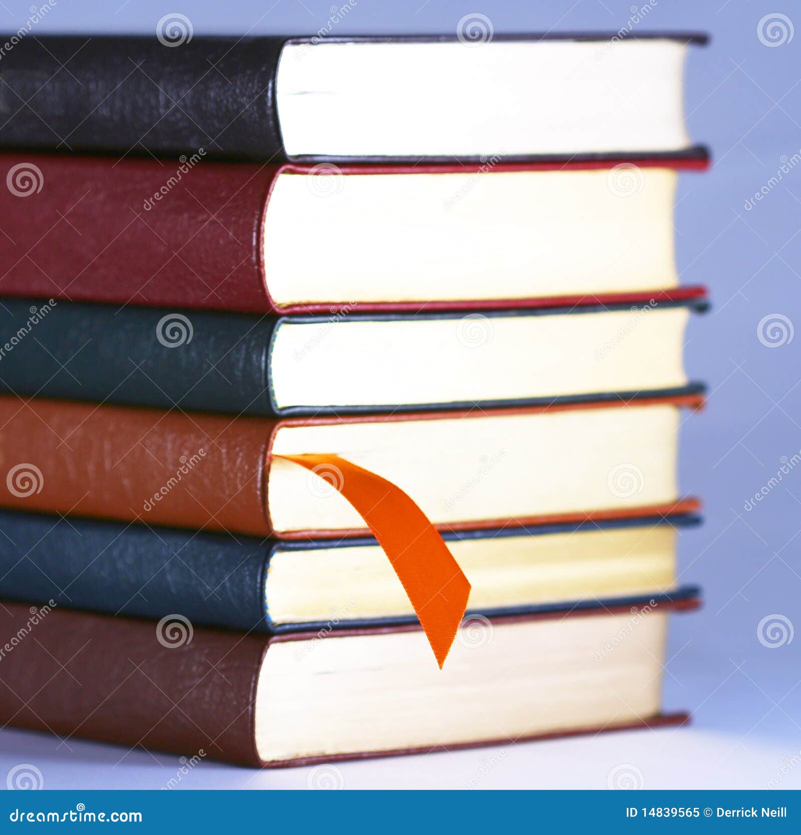An Orange Bookmark and Leather Bound Books Stock Image - Image of ...