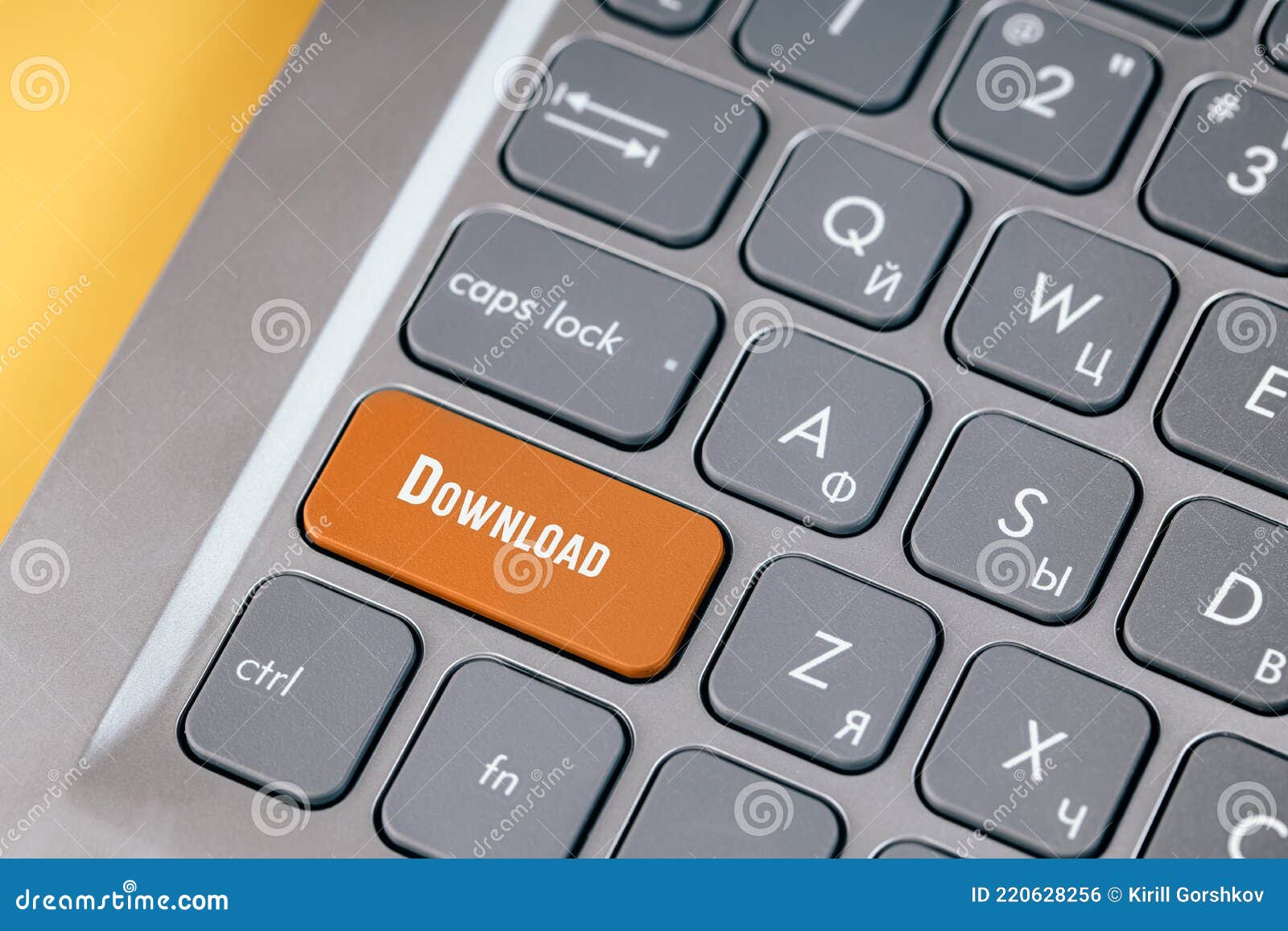 Orange Boot Key on a Gray Keyboard Close-up. Button for Downloading ...