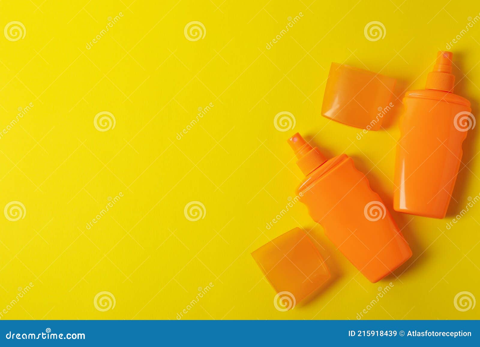Orange Bottles of Sunscreen on Yellow Background Stock Image - Image of ...