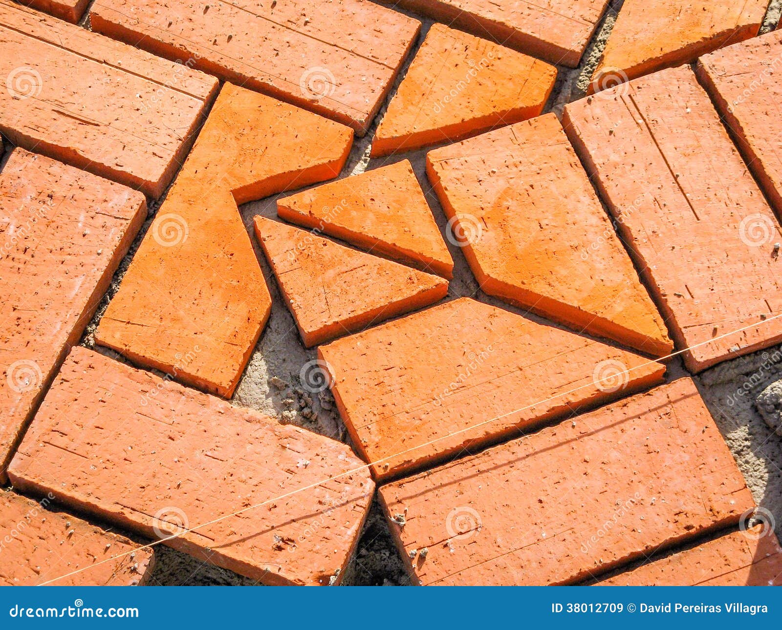 Orange Brick Paving Stones in Construction Process Stock Image - Image ...