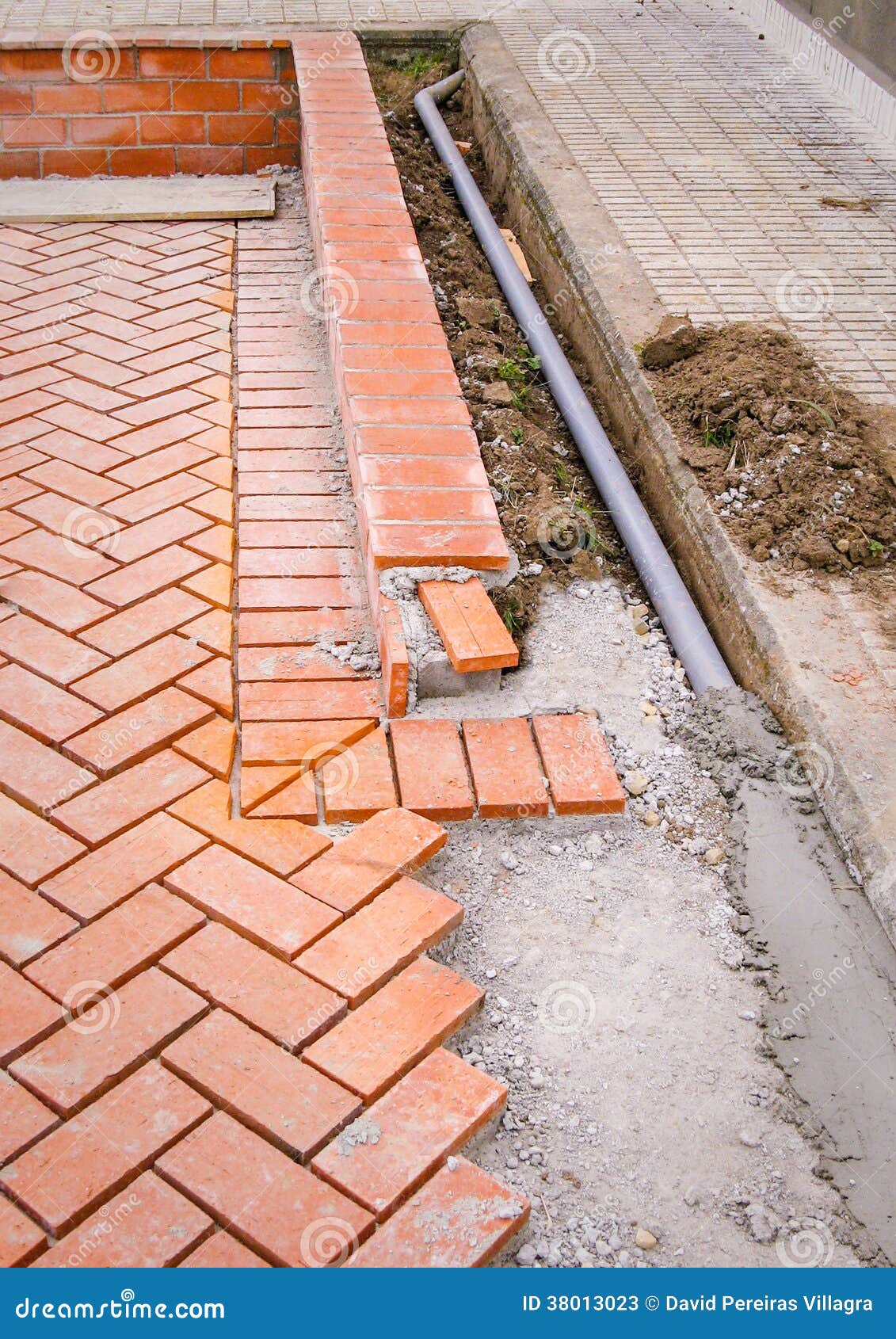 Orange Brick Paving Stones in Construction Process Stock Image - Image ...