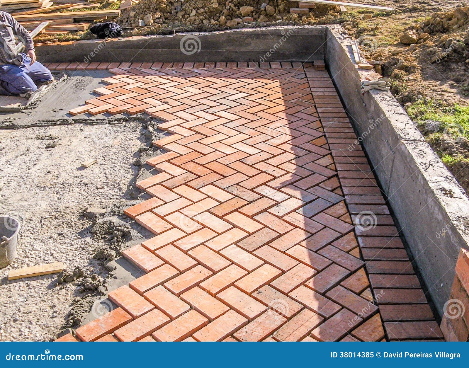 Orange Brick Paving Stones in Construction Process Stock Image - Image ...
