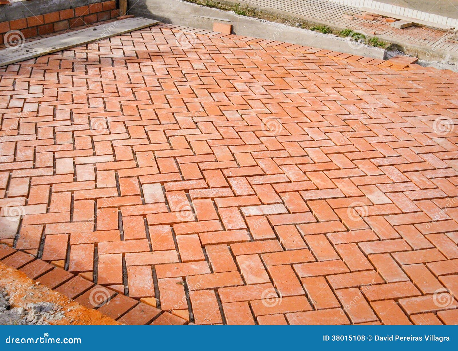 Orange Brick Paving Stones in Construction Process Stock Photo - Image ...