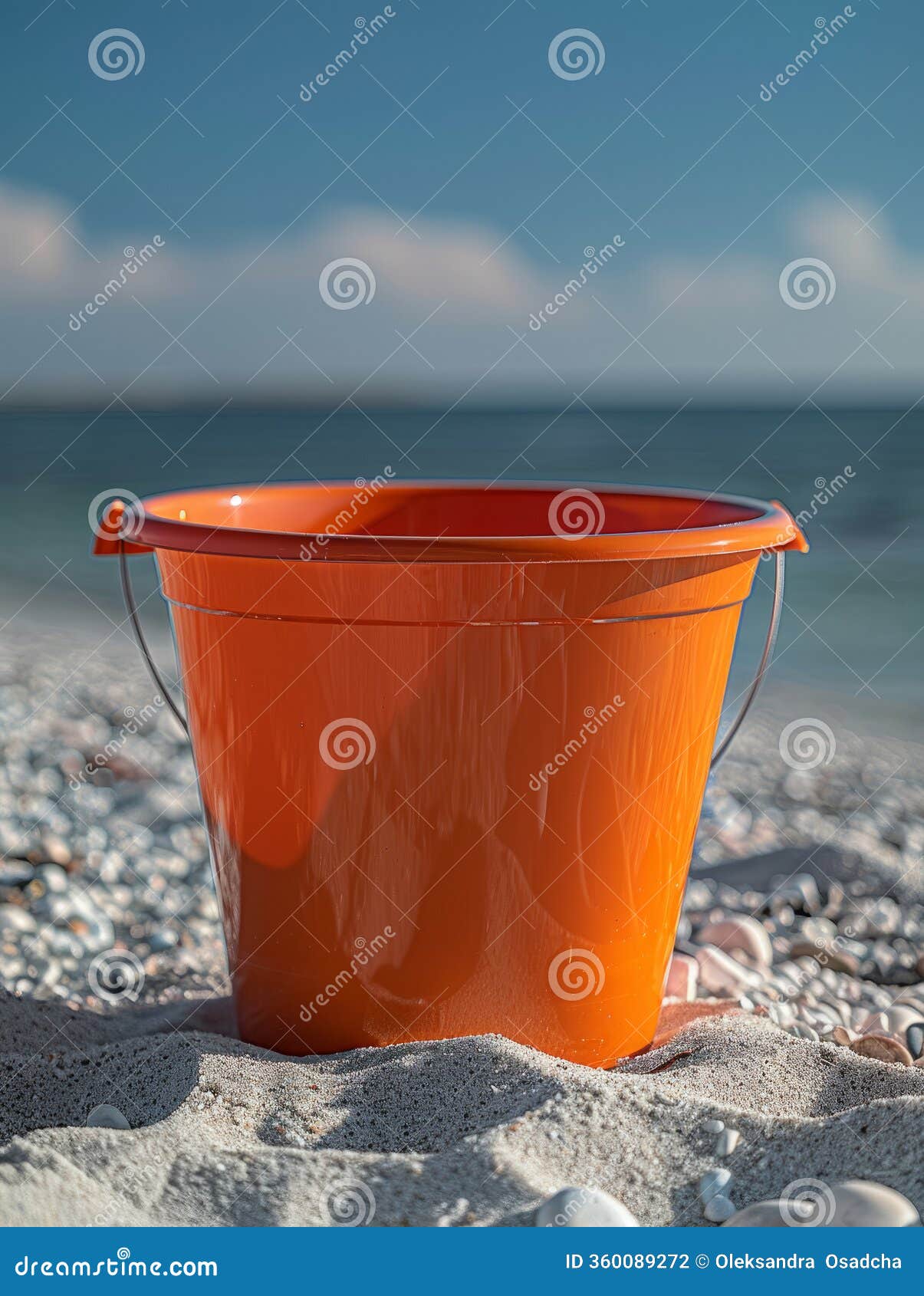Orange Bucket on Sandy Beach with Ocean Background. Stock Photo - Image ...