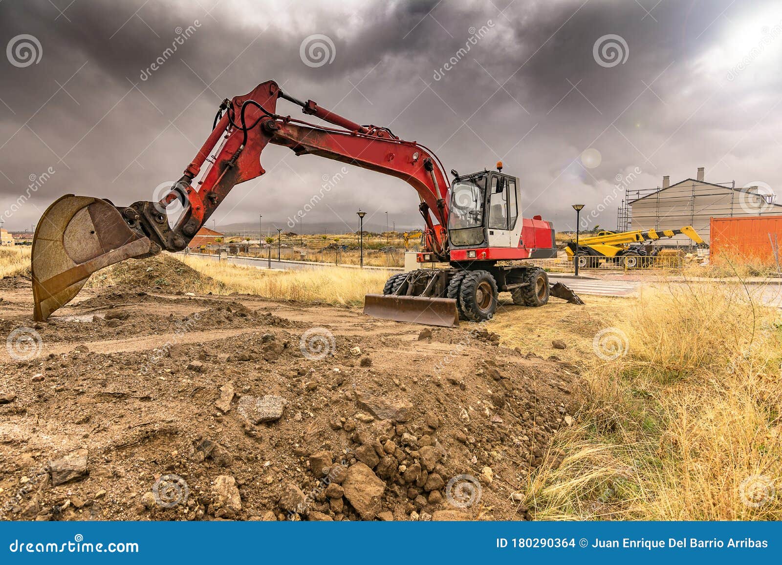 An Orange Bulldozer at a Construction Site Stock Photo - Image of ...