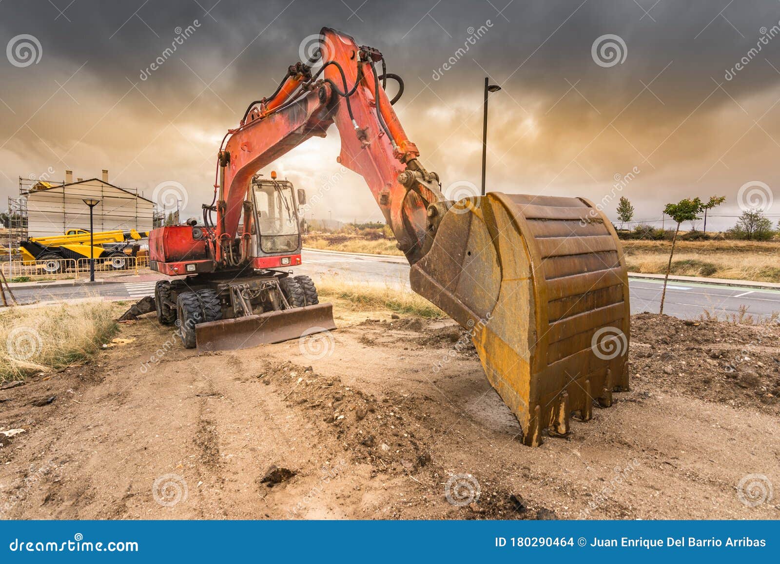 An Orange Bulldozer at a Construction Site Stock Photo - Image of ...