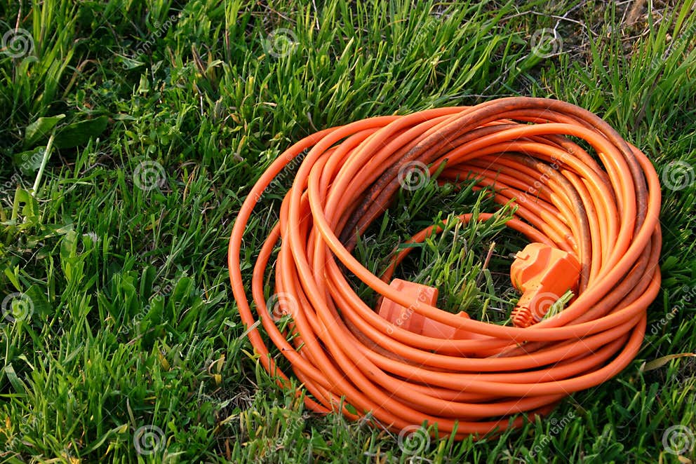 Orange cable in the grass stock photo. Image of cable, environment - 704528