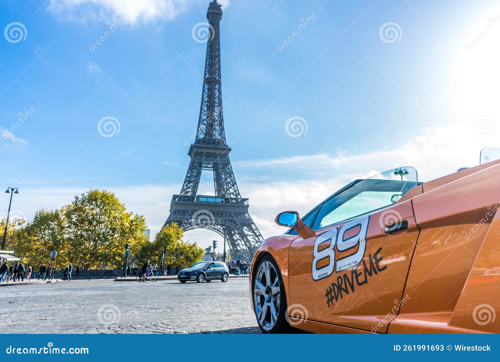 Orange Car in Front of the Eiffel Tower during the Day. Editorial Stock ...