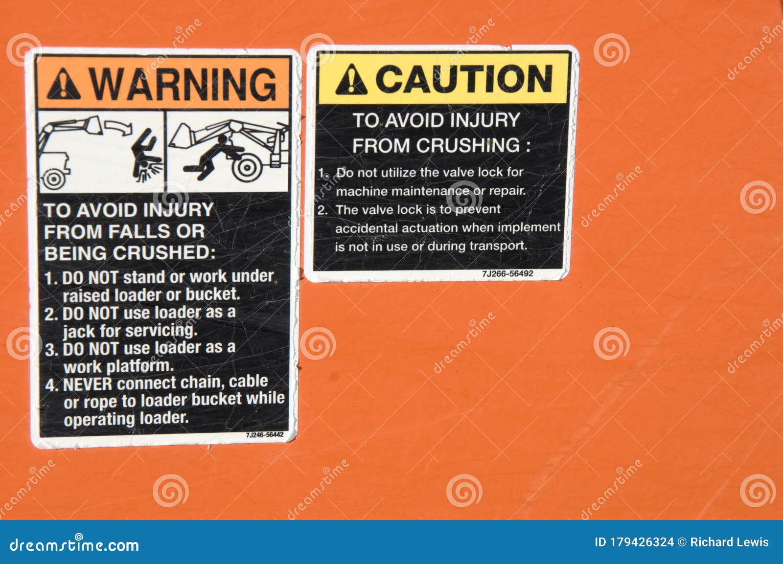 An Orange Caution Sticker on Front End Loader Tractor. Stock Photo ...