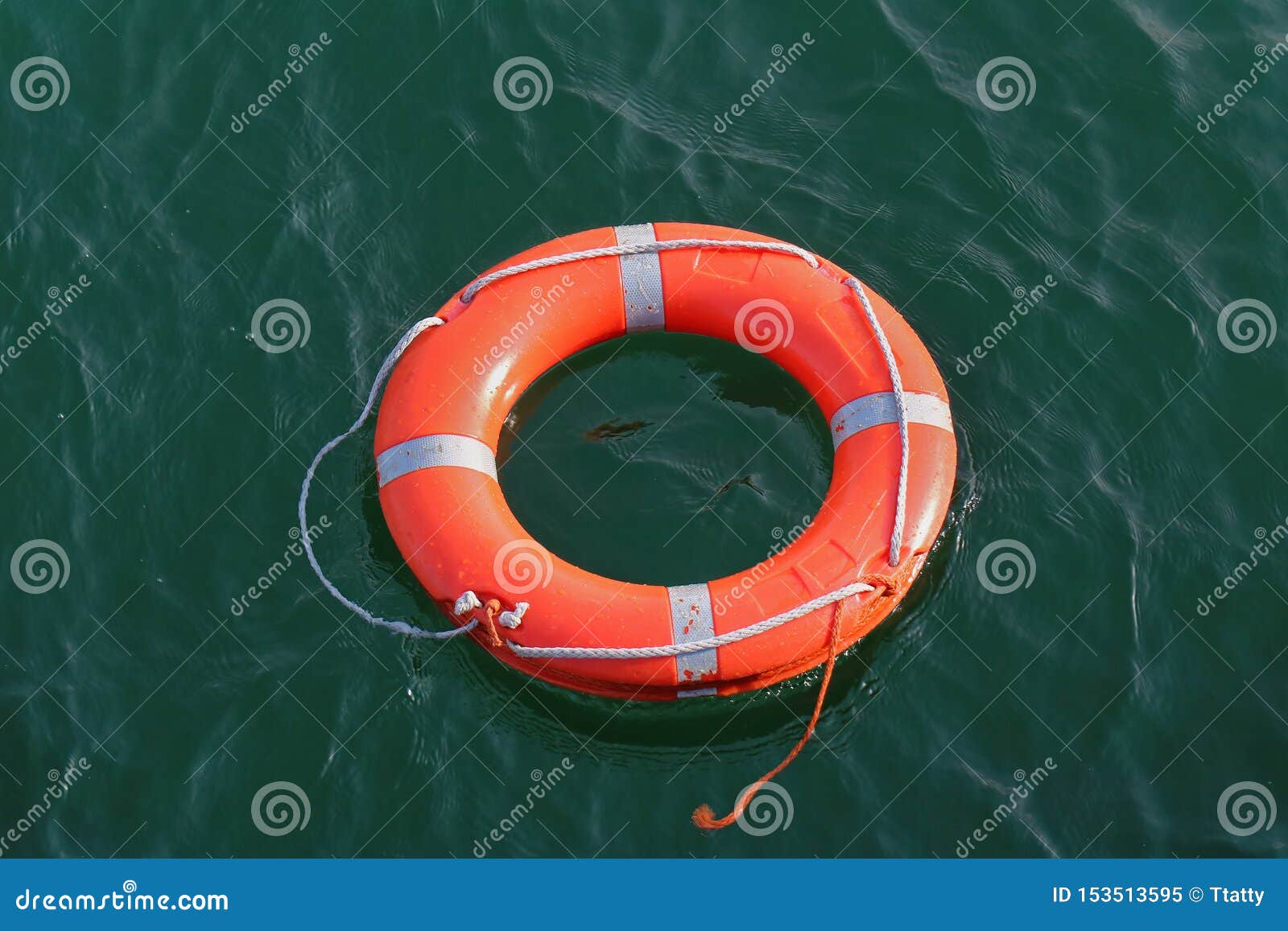 Orange Circle Lifebuoy Floating on Water Stock Image - Image of lake ...