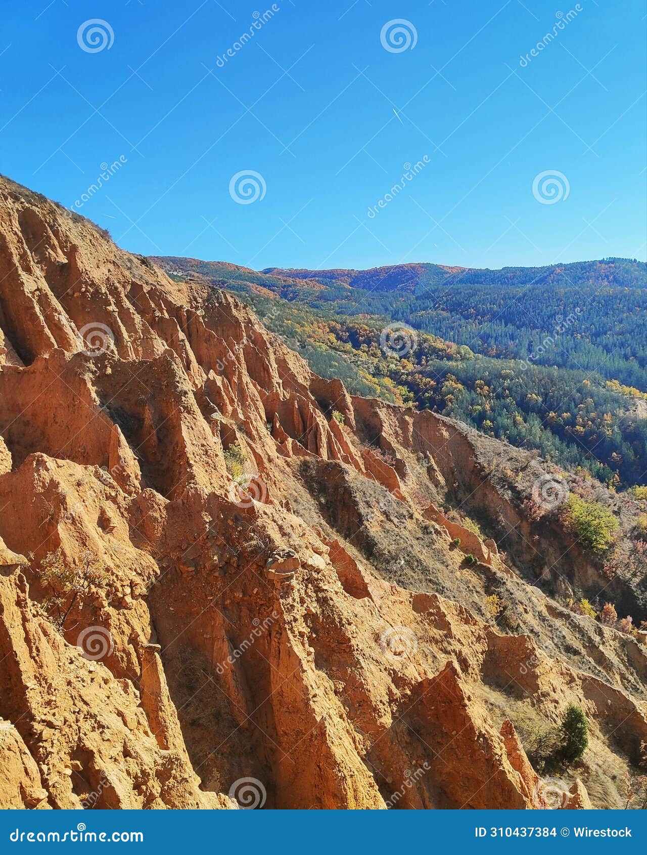 Orange Cliffs with Vegetation and Rocks on a Mountainside: Stob ...