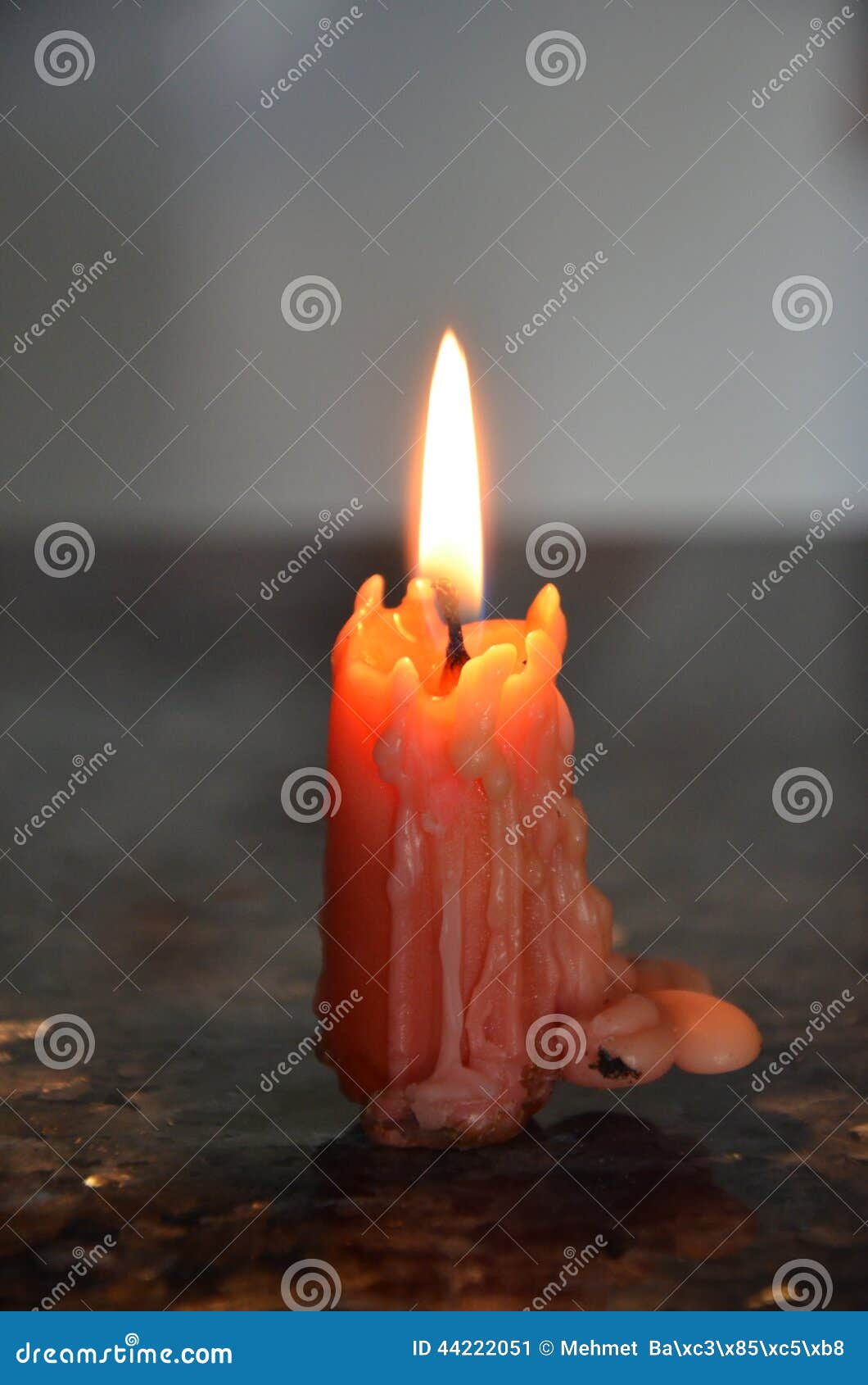 An orange colored candle stock image. Image of glint - 44222051
