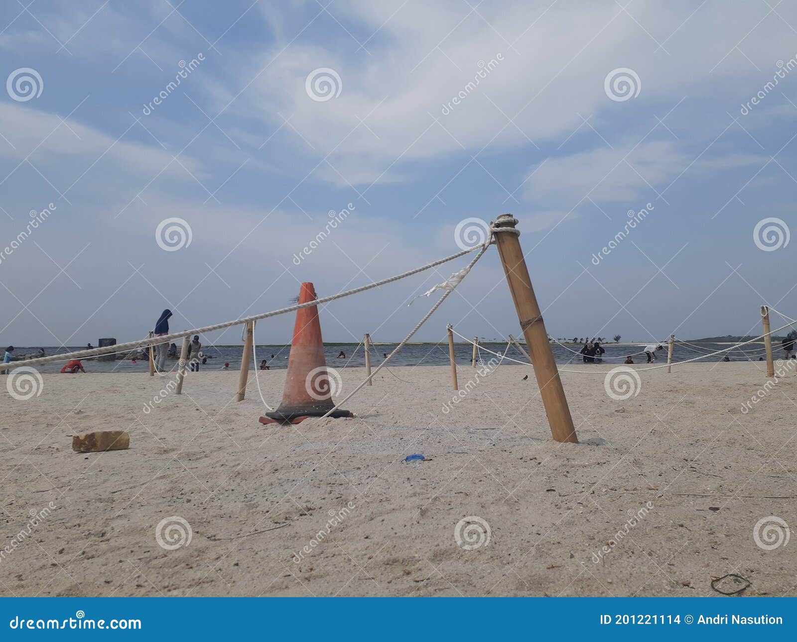 Orange cone on beach stock photo. Image of vacation - 201221114