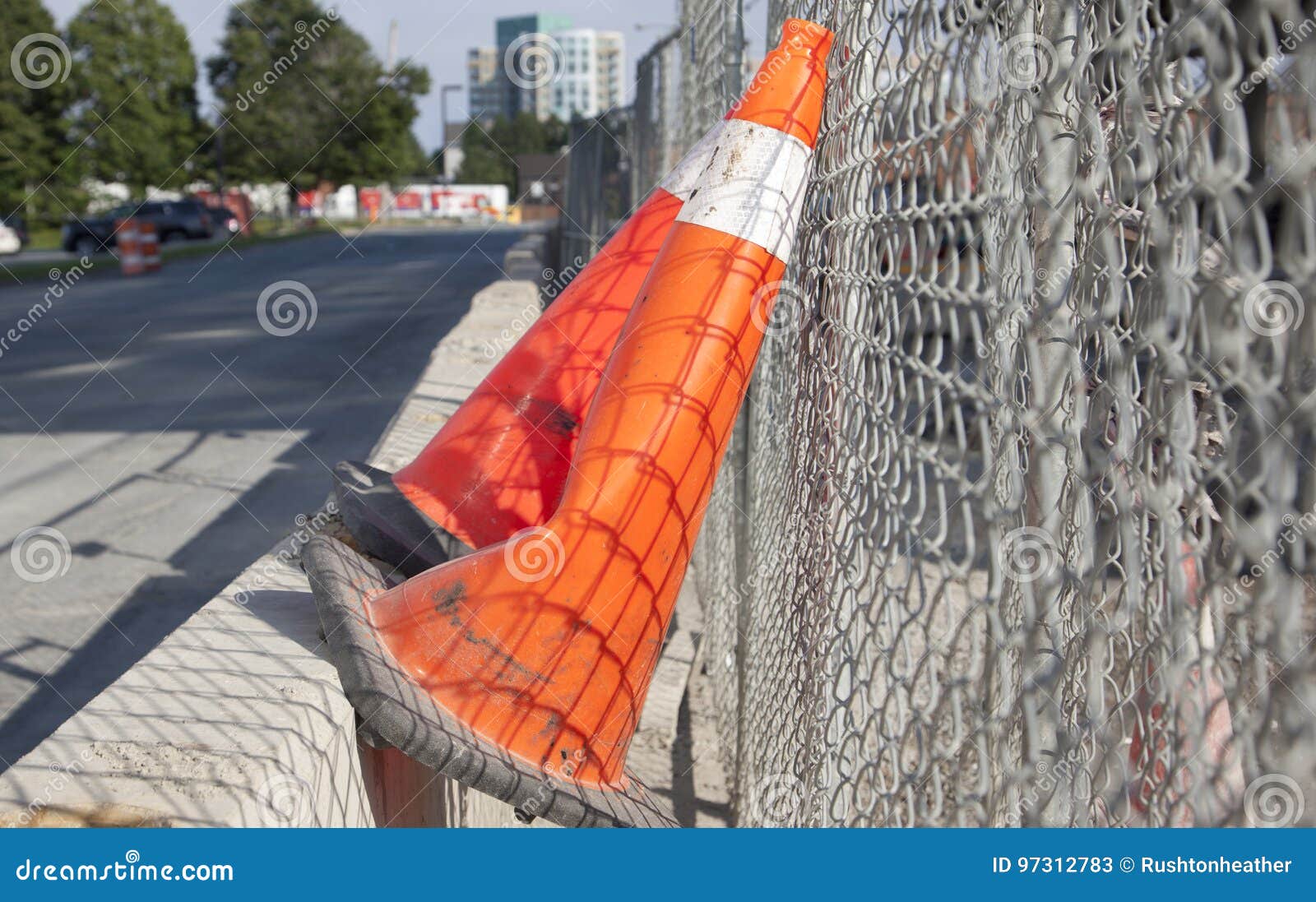 Orange Cones Against a Fence Stock Image - Image of silver, outside ...