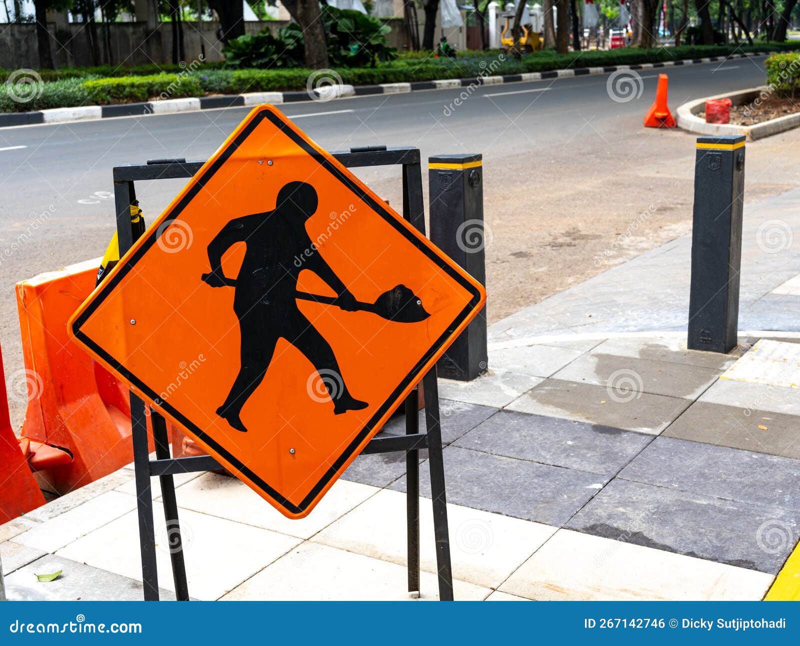An Orange Construction Traffic Sign on a Sidewalk Stock Photo - Image ...