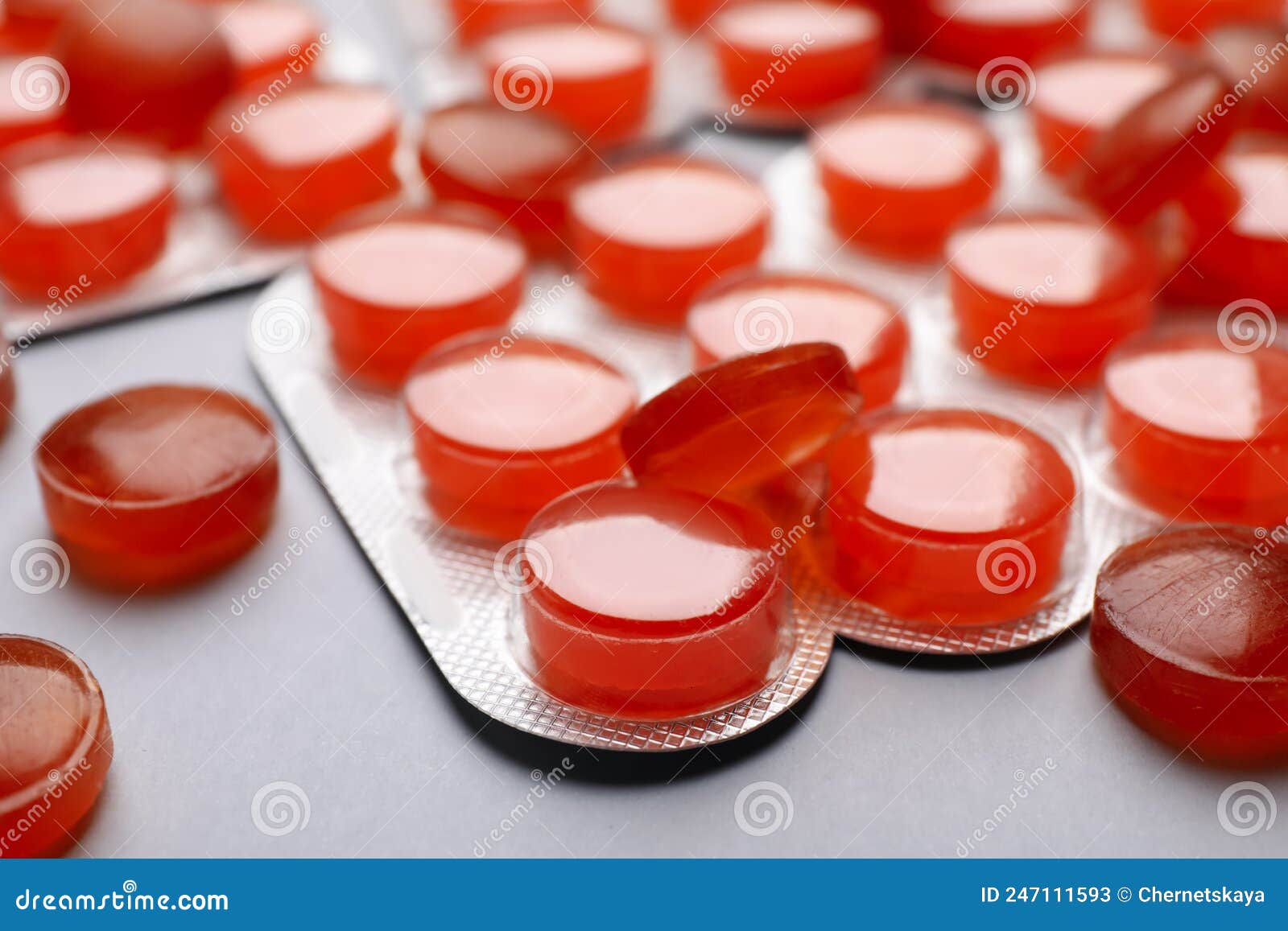 Orange Cough Drops on Grey Background, Closeup Stock Image - Image of ...