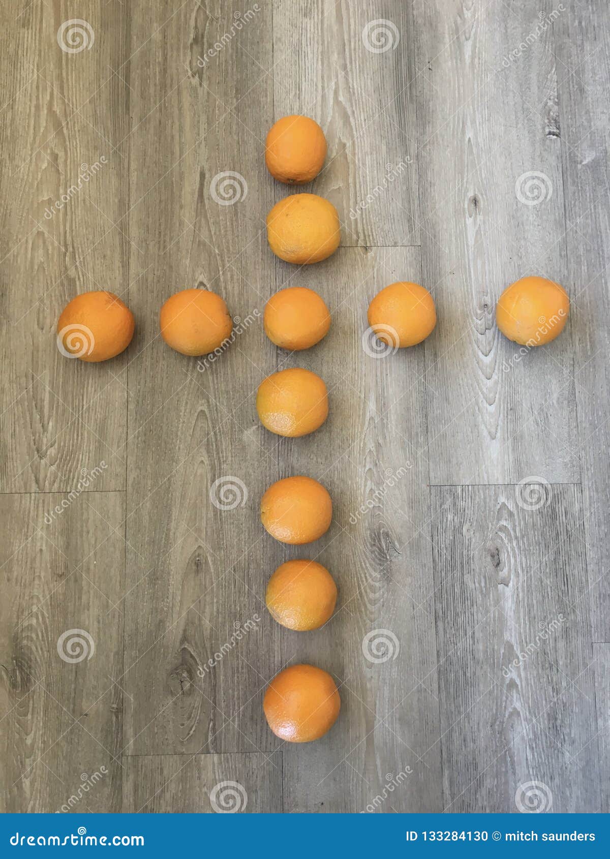 Orange Cross on a Wooden Floor Stock Photo - Image of vitamin, shape ...