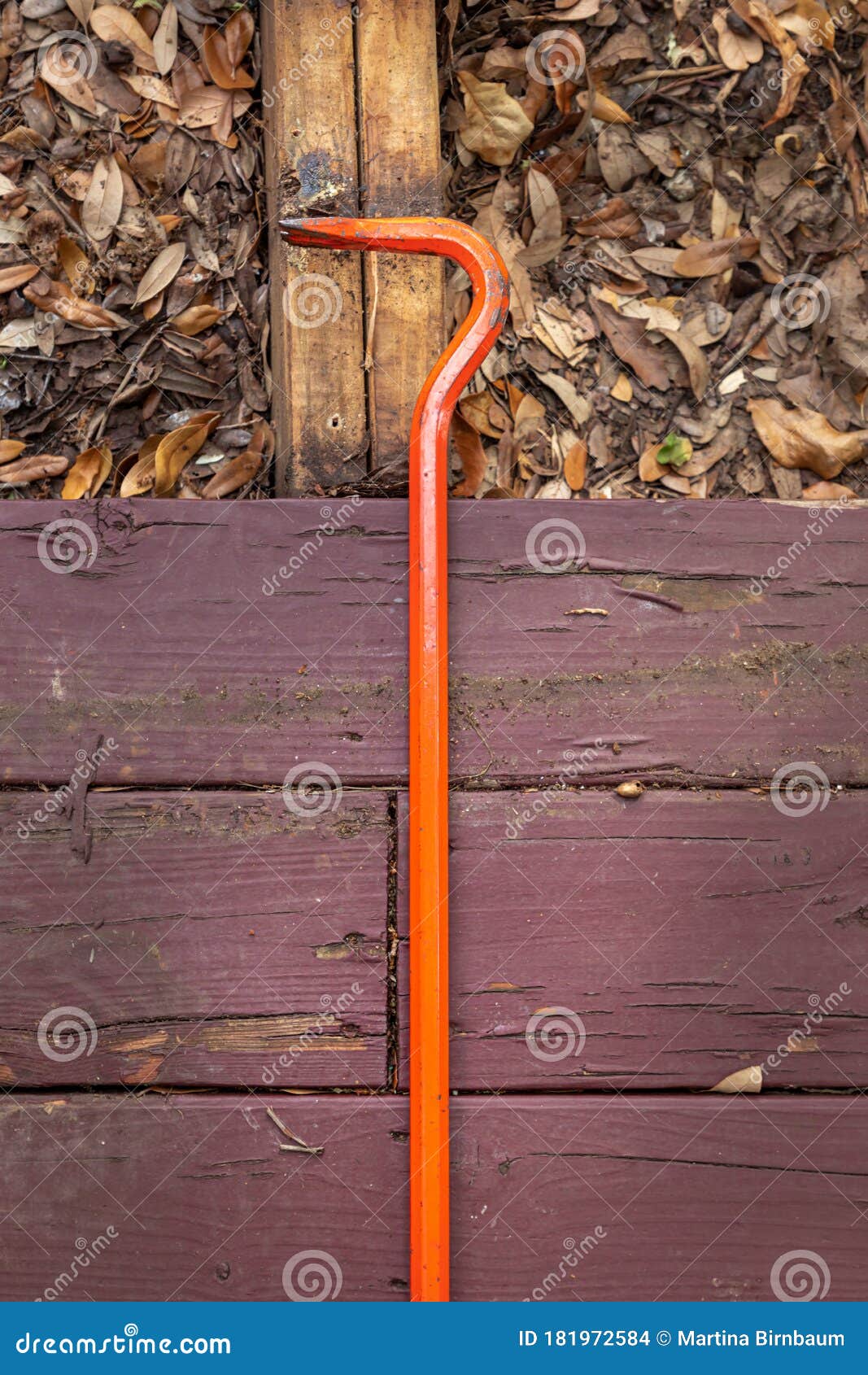 An Orange Crowbar on an Old Wooden Plank Stock Photo - Image of ...