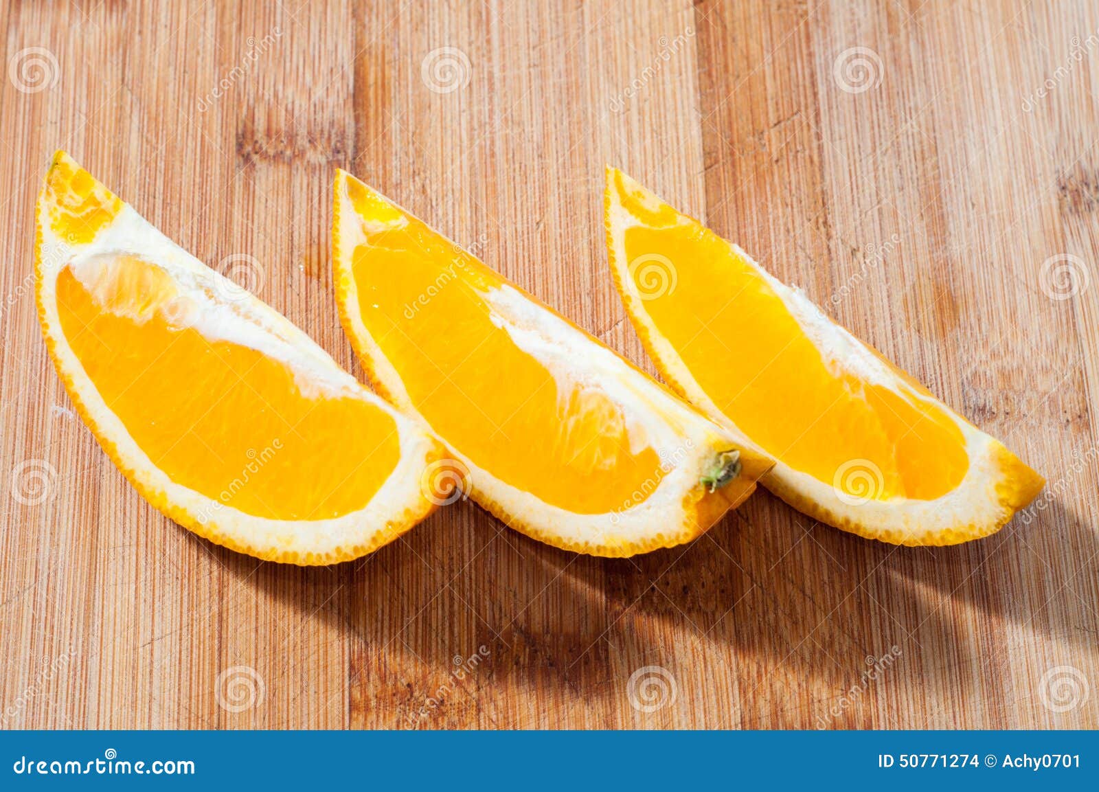 Orange cuted into pieces stock photo. Image of chopboard - 50771274