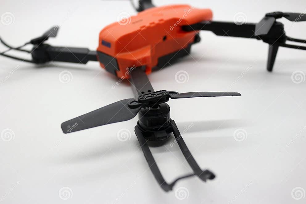 Orange drone with camera stock photo. Image of moving - 285423896