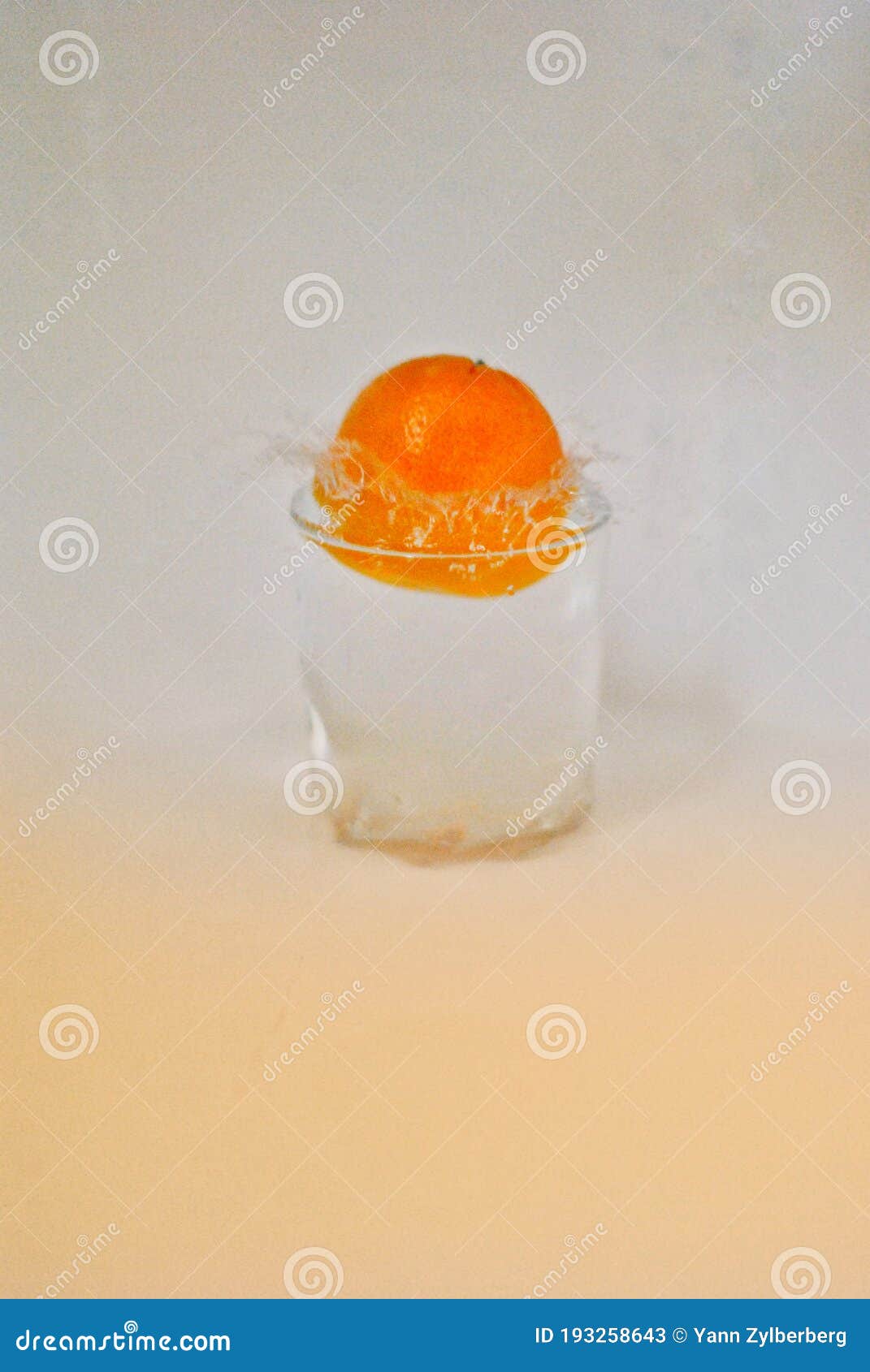 Orange Dropping into a Cup of Water Stock Image - Image of colour ...