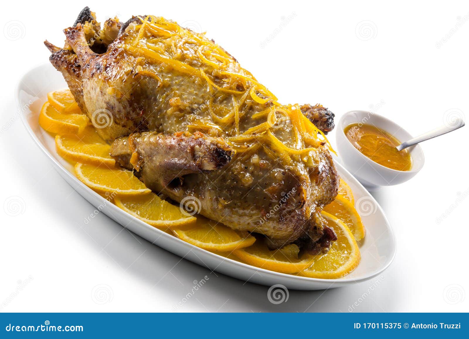 Orange Duck on a Plate and Bowl with Sauce Stock Image - Image of ...