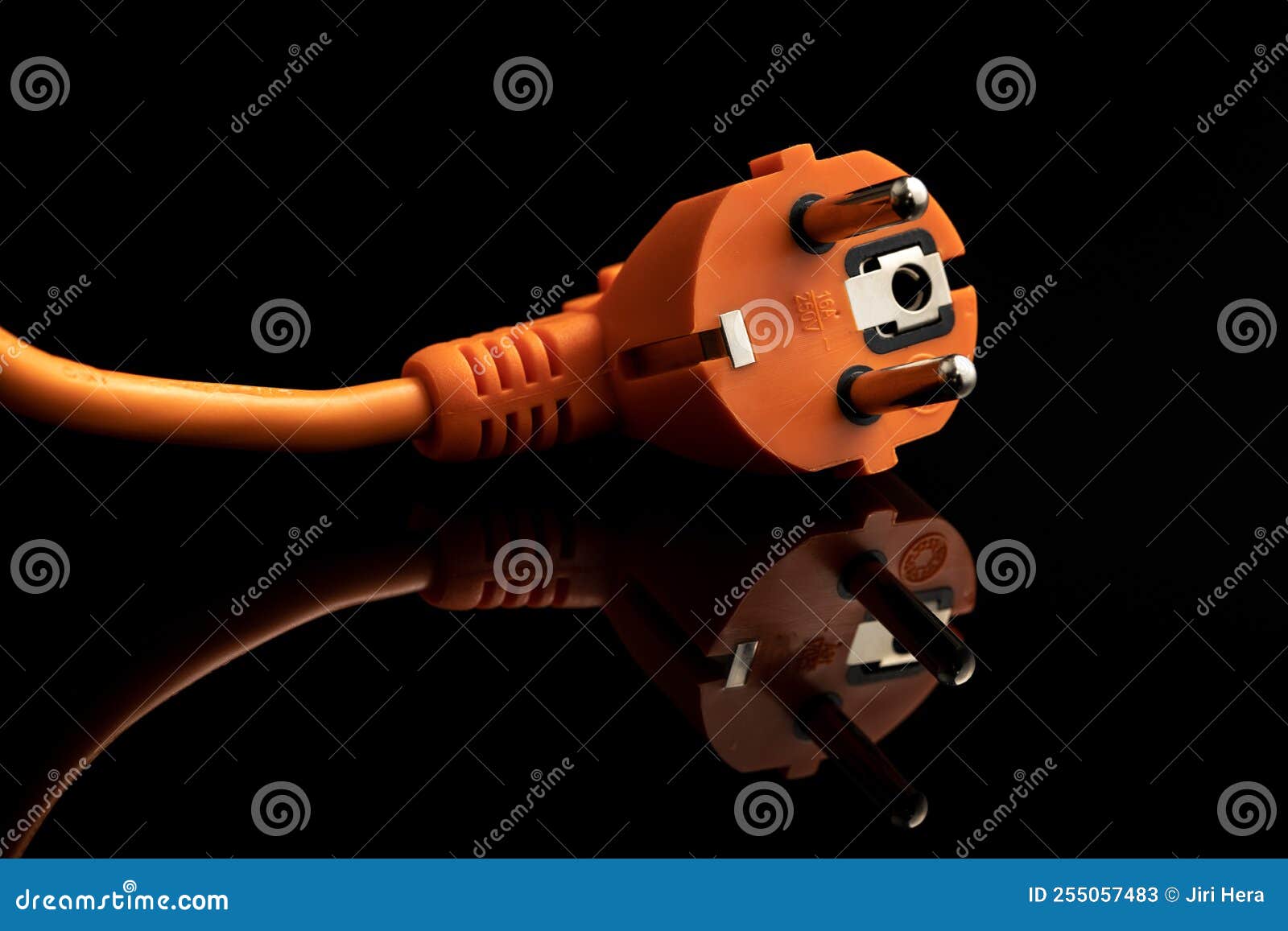 Orange Electric Plug on Black Background Stock Image - Image of ...