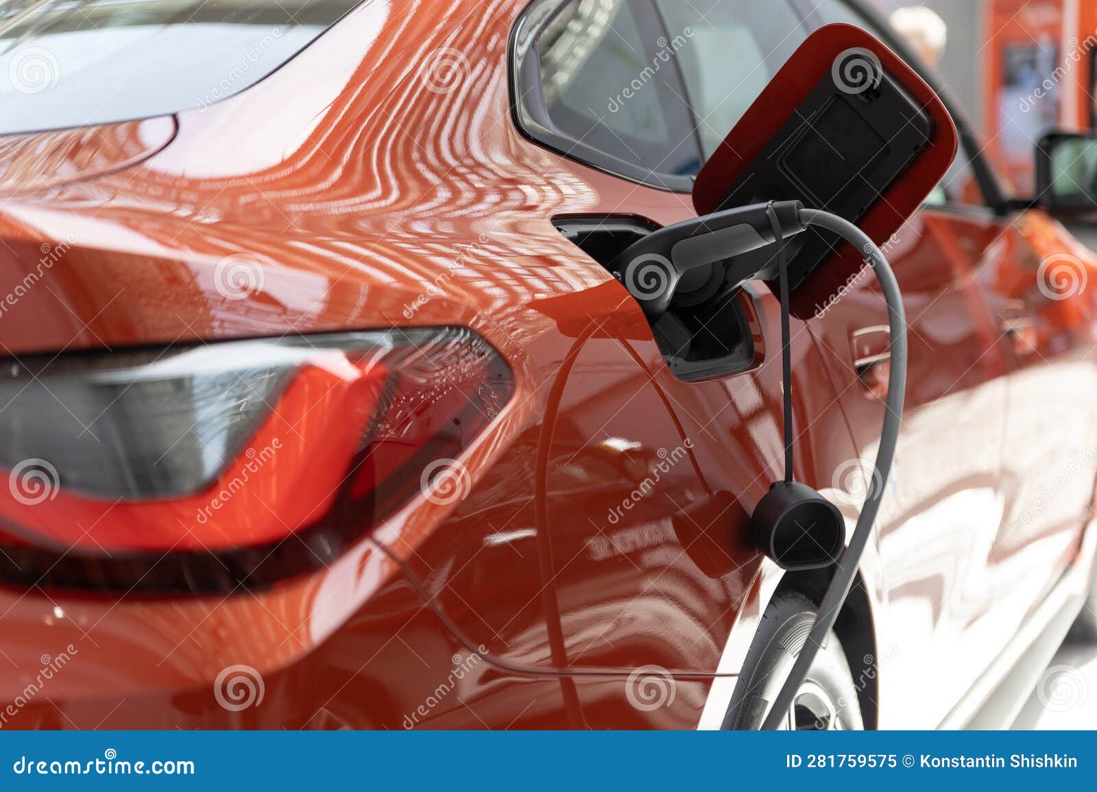 Orange Electro Car on Charge at the EV Charging Station Stock Image ...