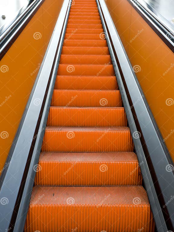 Orange escalator stock image. Image of direction, steel - 9004243
