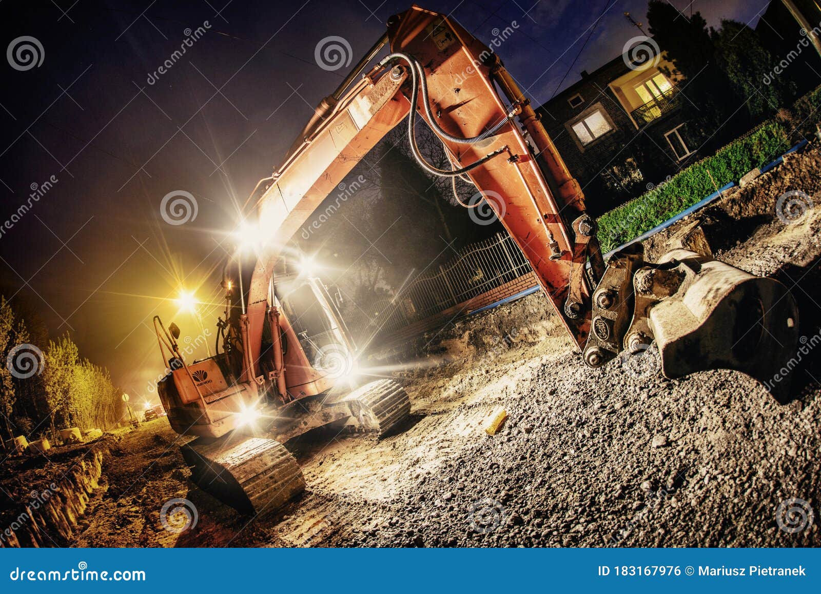 Orange Excavator Digger Working at Night on the Street Stock Photo ...