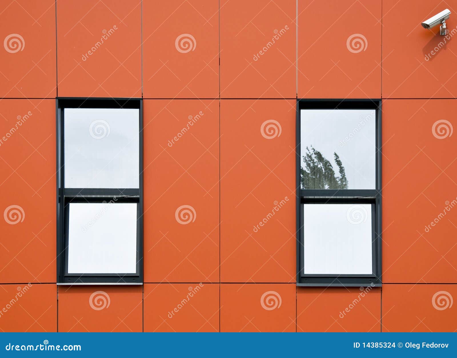 Orange Facade Of Building With Pattern Of Oval Shaped Mirror Windows ...