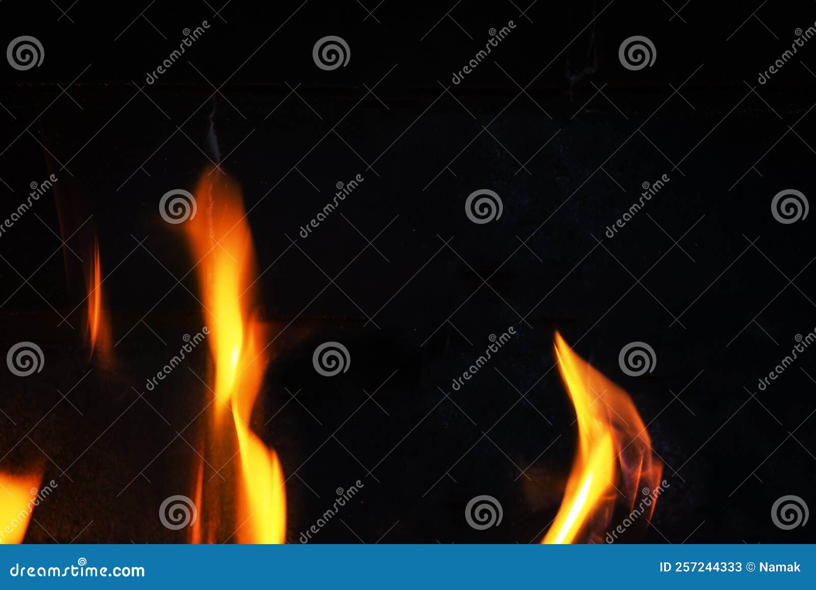 Orange Flame of Fire in the Fireplace on a Dark Background, Horizontal ...
