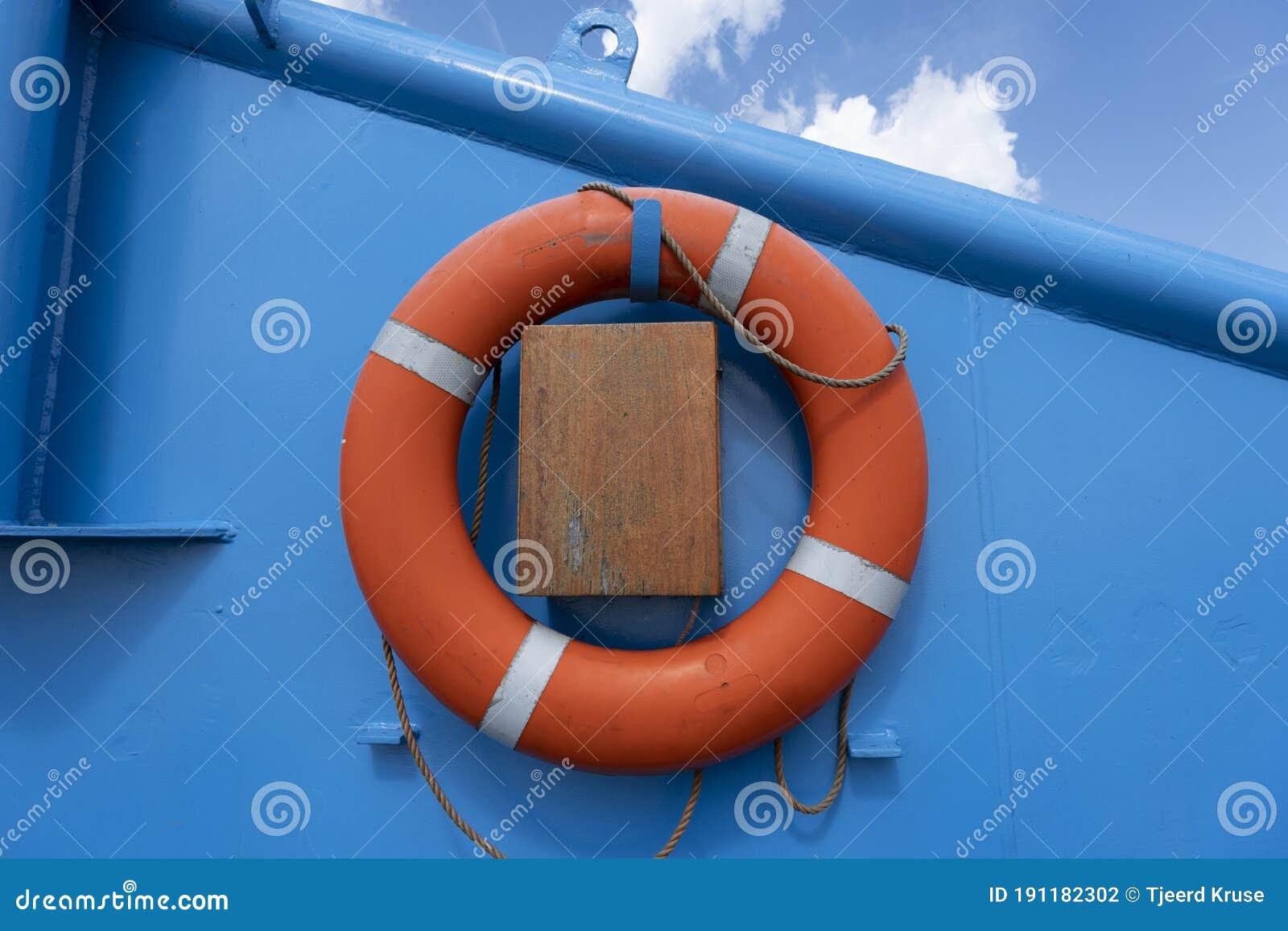 Orange Float Ring on a Blue Metal Wall Stock Photo - Image of buoyancy ...
