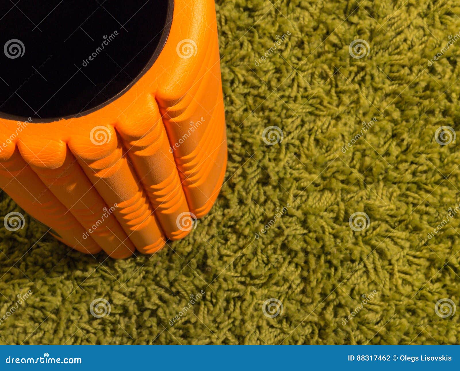 Orange Foam Roller on Green Background Stock Photo - Image of pain ...