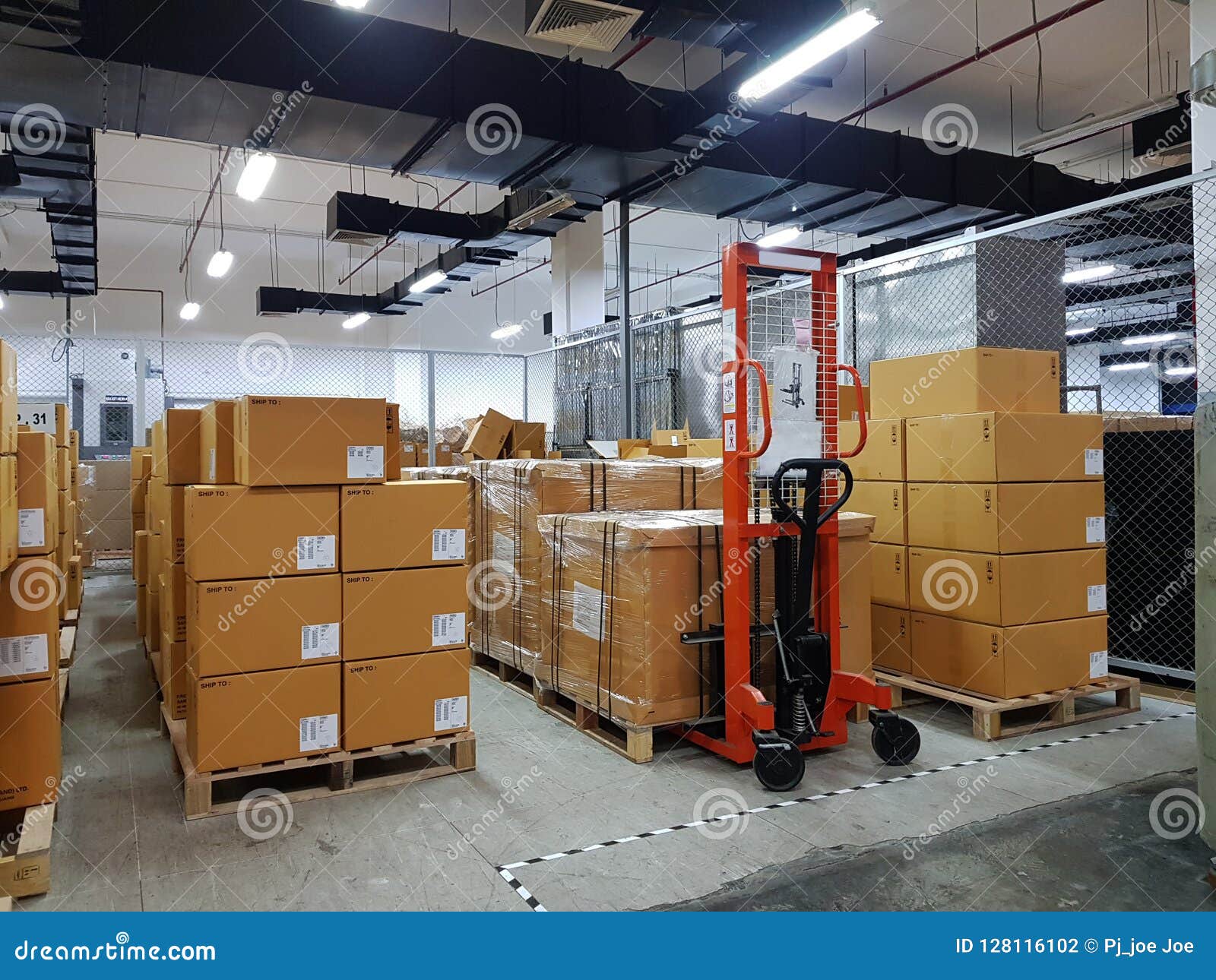 Orange Fork Lifter Work in Big Warehouse Stock Photo - Image of ...