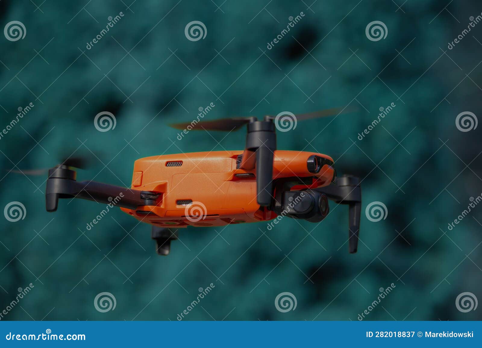 An Orange, Four-engined Drone in Flight. Stock Image - Image of aerial ...