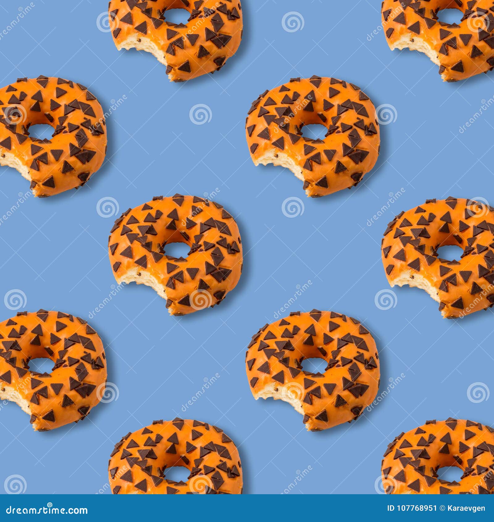 Orange Glazed Donut Pattern on Blue Pastel Background. Stock ...