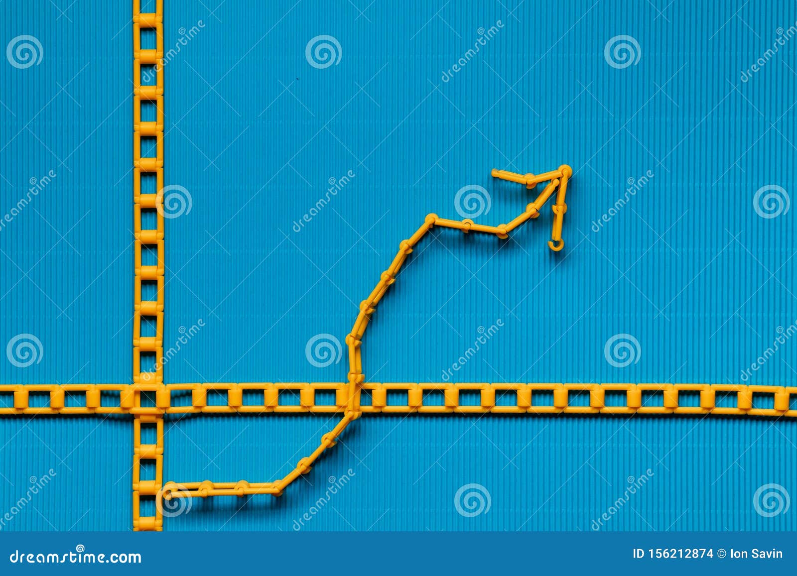 An Orange Graph on Blue Background, Shot from Above Stock Photo - Image ...
