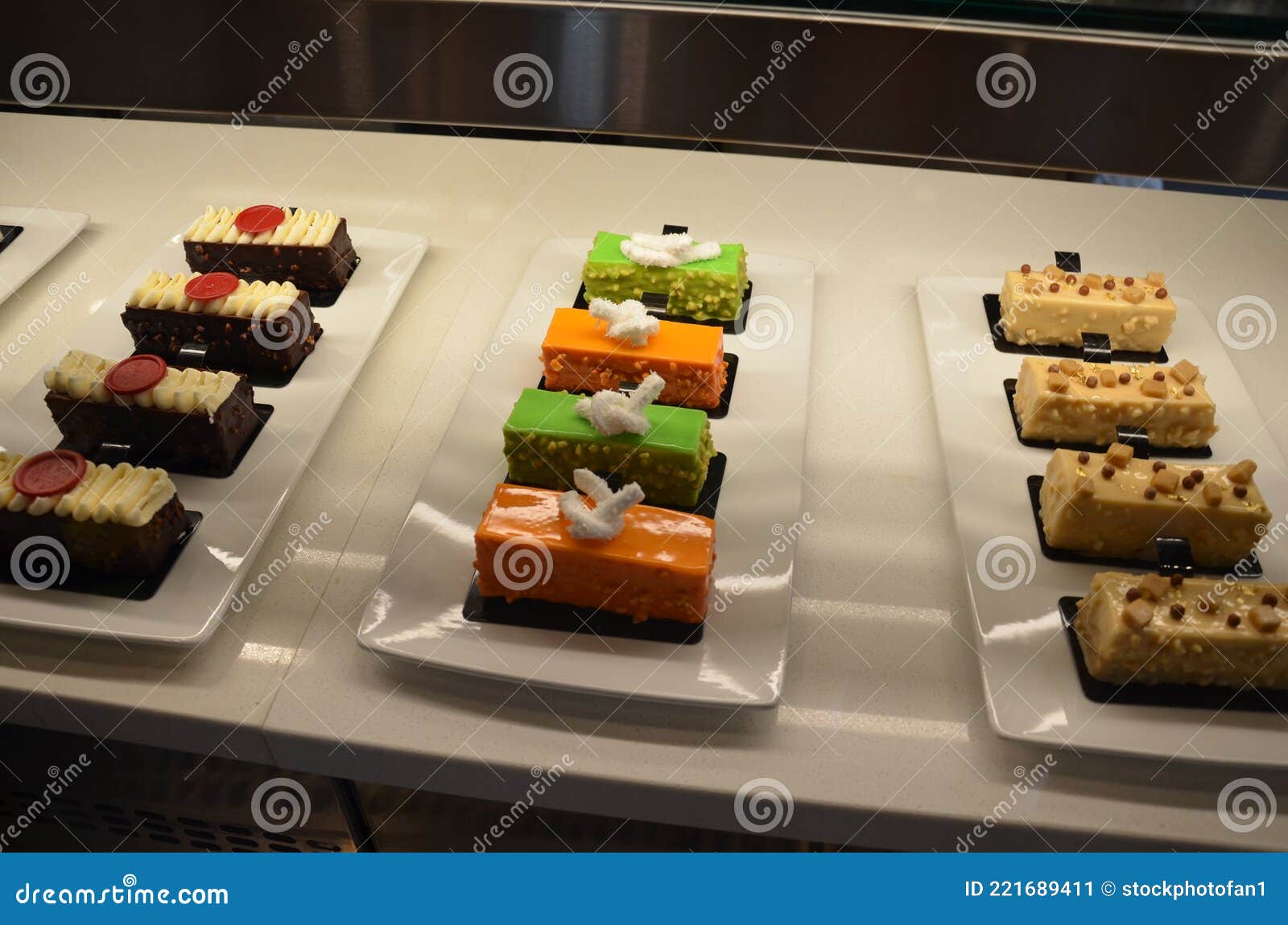 Orange and Green Cakes or Desserts in Display Case Stock Image - Image ...