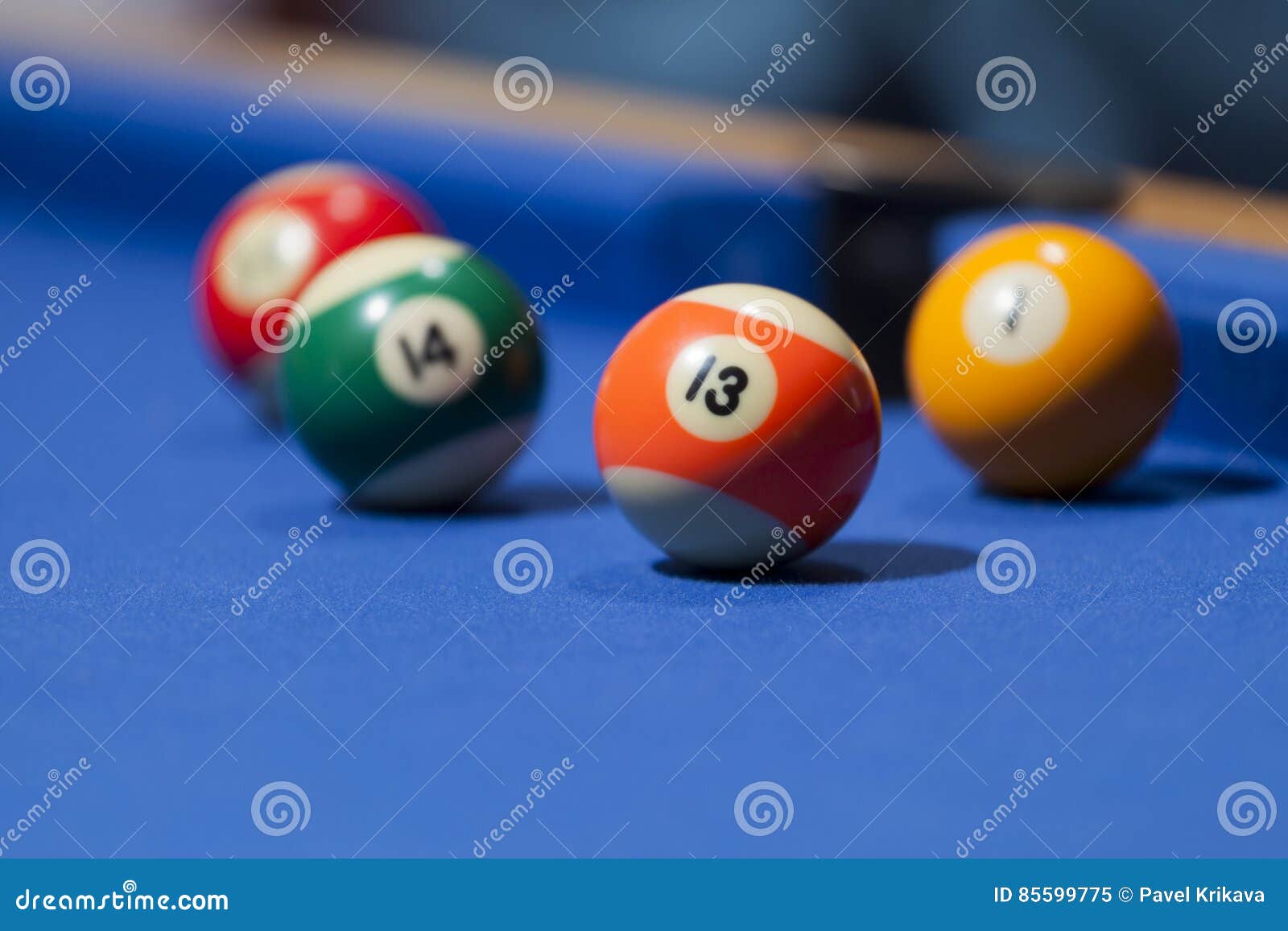 Orange, Green, Yellow and Red Billiard Balls in a Pool Table Stock ...