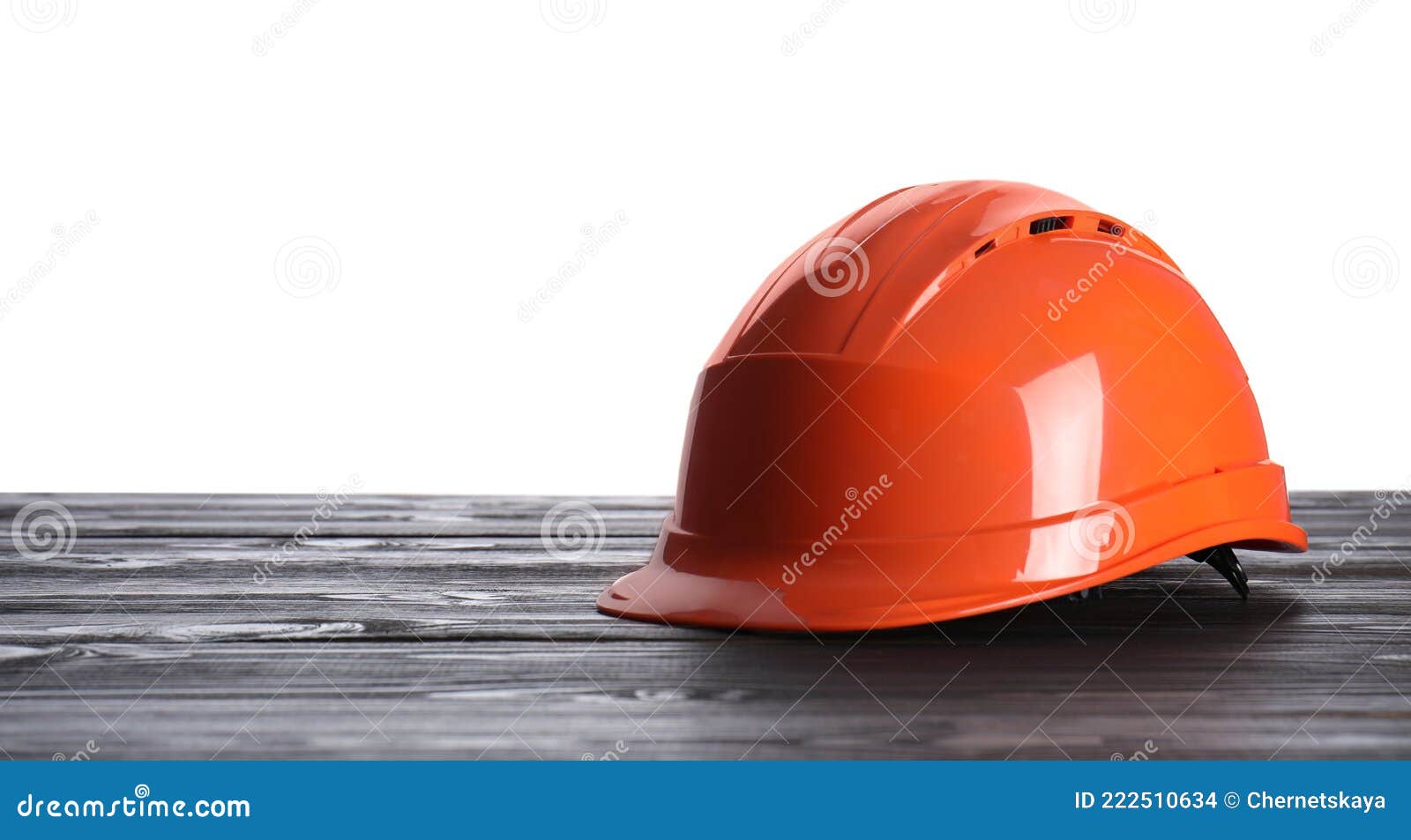 Orange Hard Hat on Wooden Table Against White Background. Space for ...
