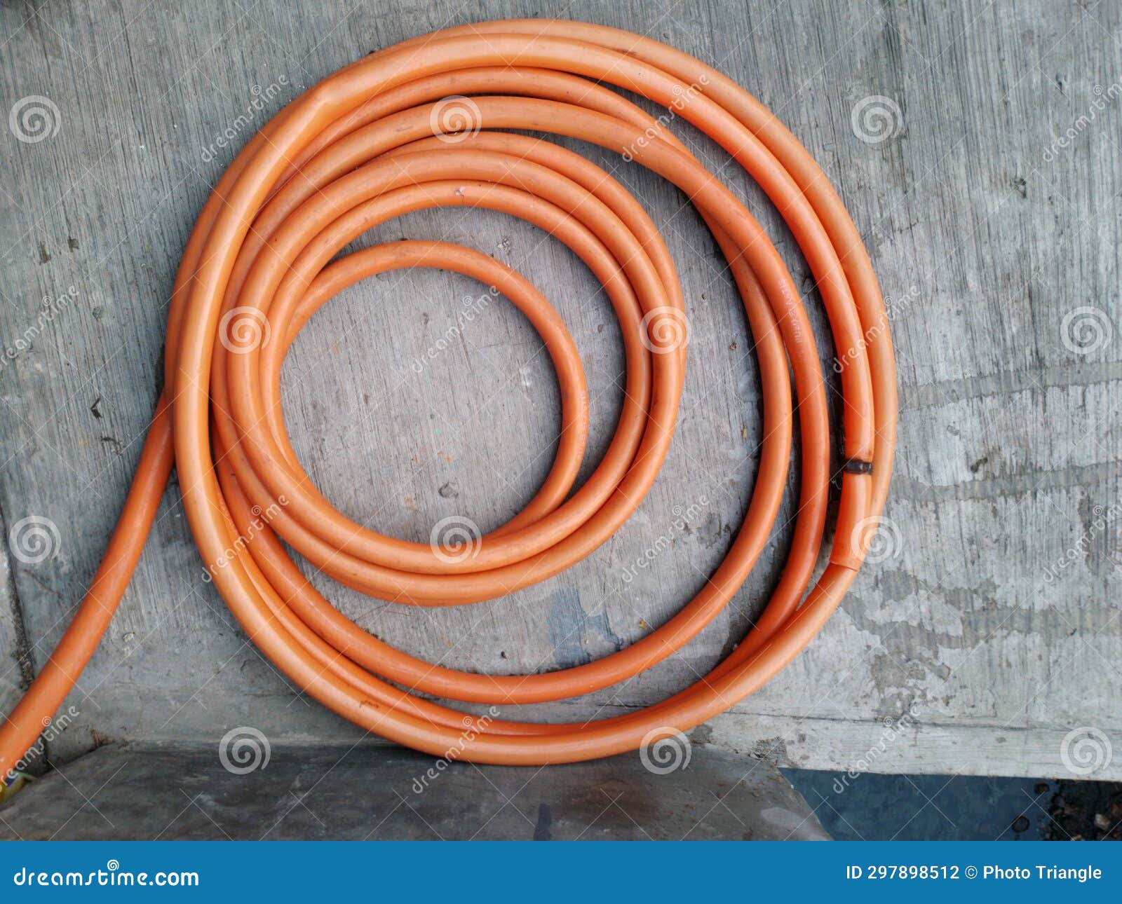 Orange hose rolled up stock photo. Image of irrigation - 297898512